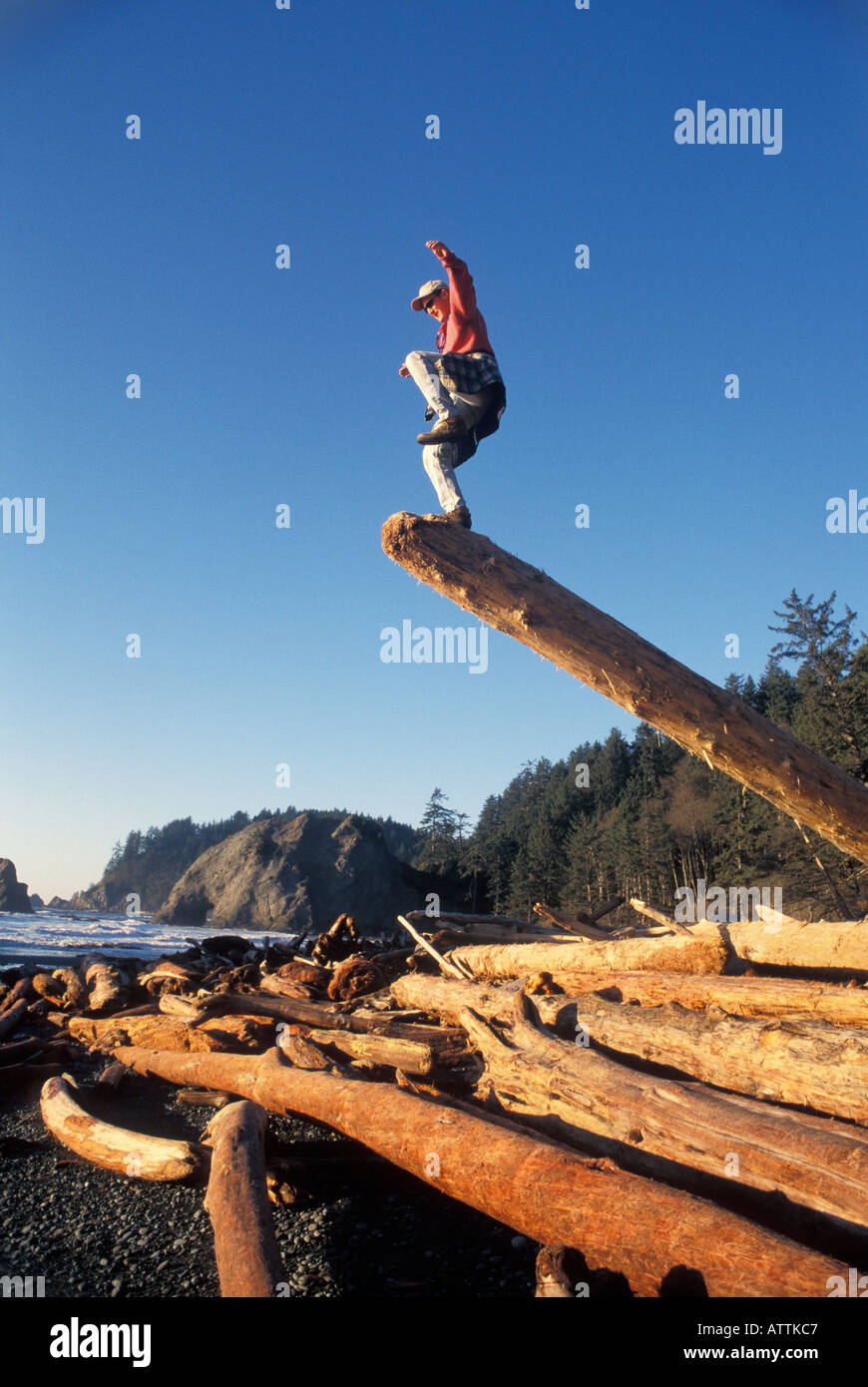 Young man balancing on a log hi-res stock photography and images - Alamy