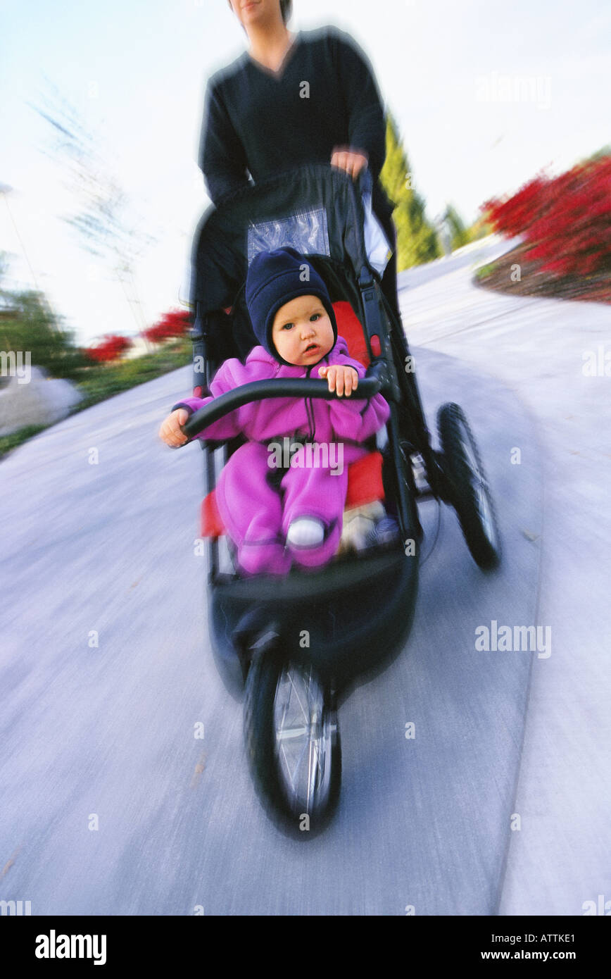 Parents pushing baby carriage hi-res stock photography and images - Alamy