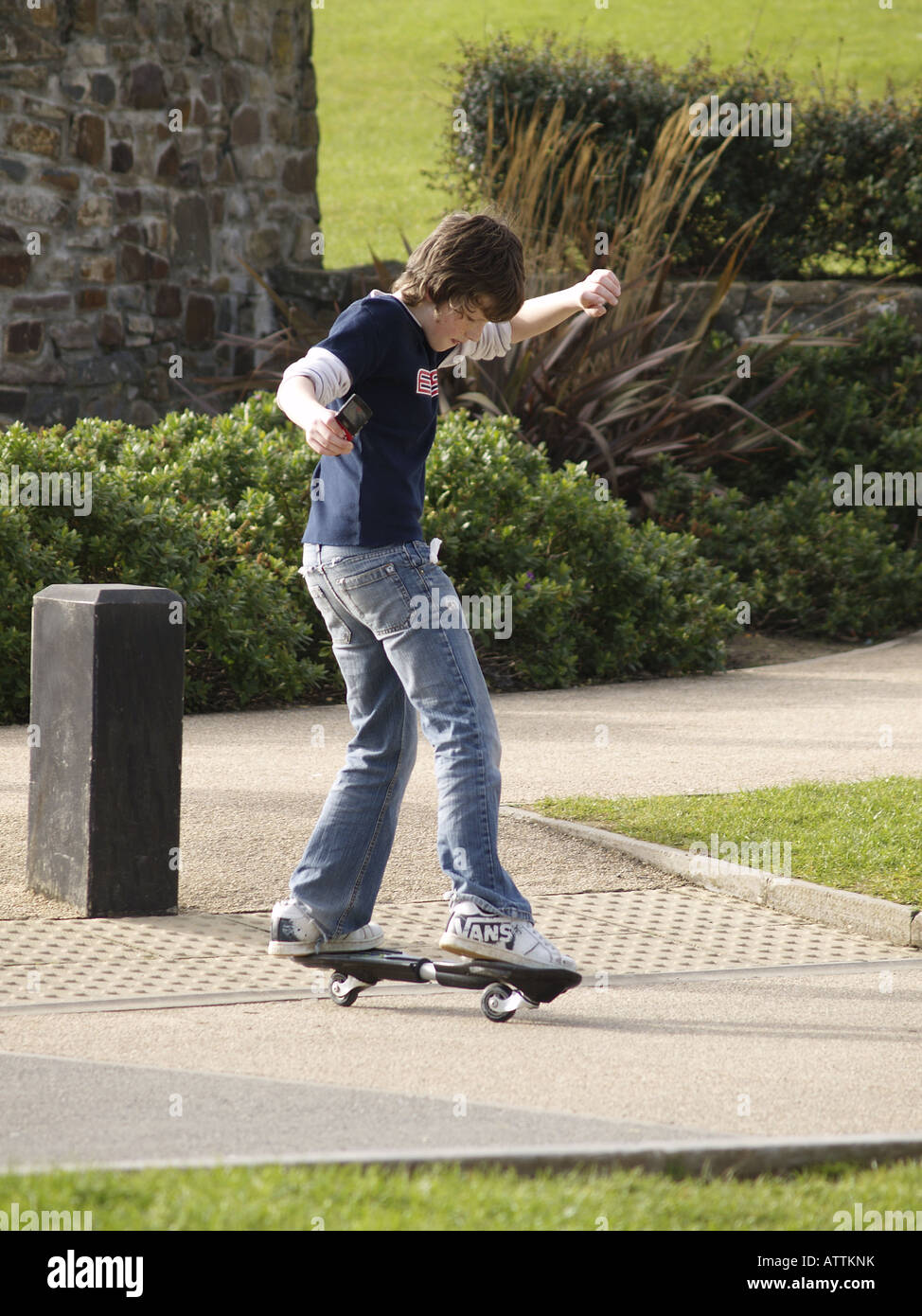 Young boy on a street surfer Stock Photo - Alamy