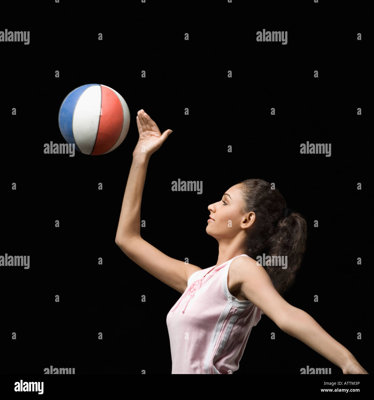 Side profile of a young woman playing volleyball Stock Photo - Alamy