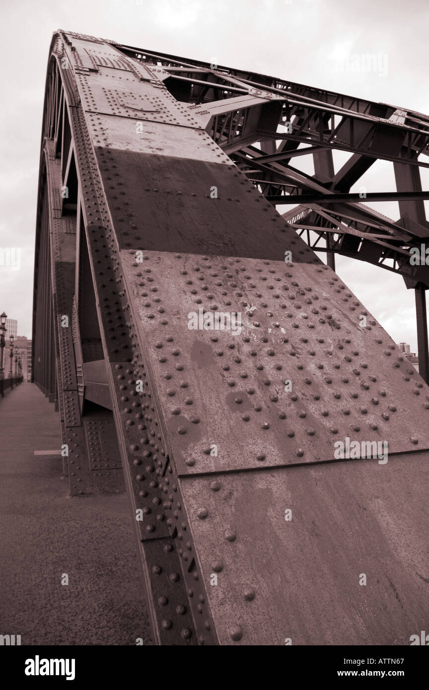 The Tyne Bridge close up of metalwork and rivets toned black and white ...
