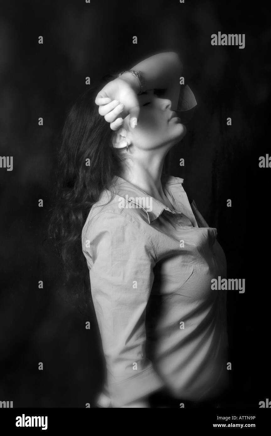 Side view of a sad young woman arm on head Stock Photo - Alamy