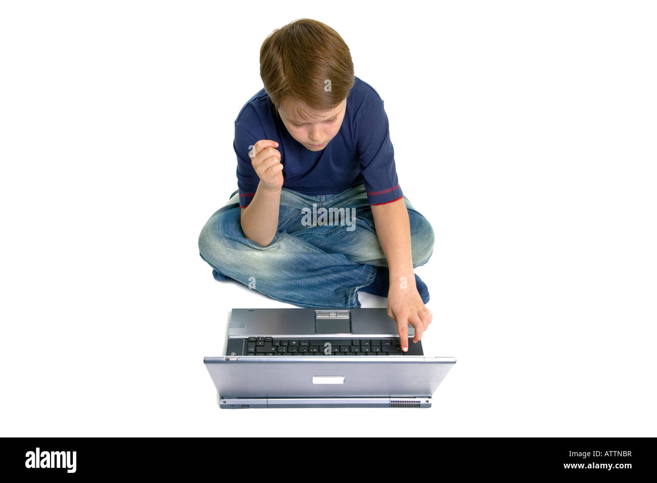 Boy working on a laptop computer white background with shadow view from ...
