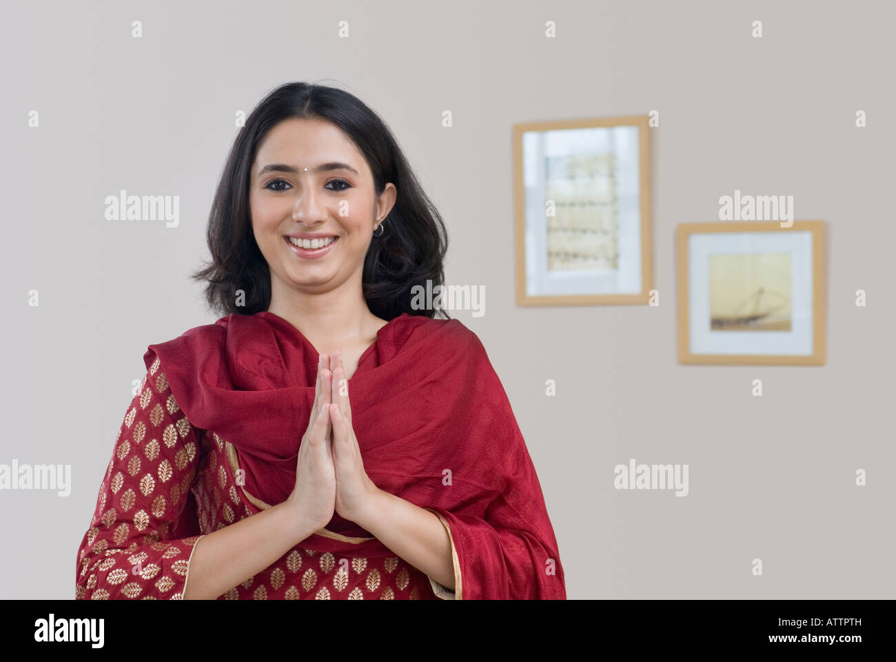 Woman greeting in prayer position hi-res stock photography and images ...