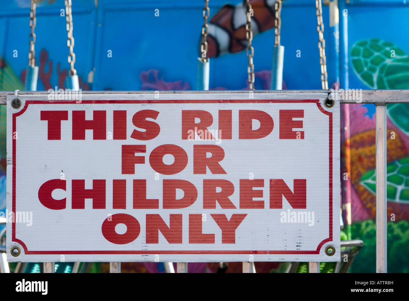 Children only sign at carnival ride in United States Stock Photo - Alamy