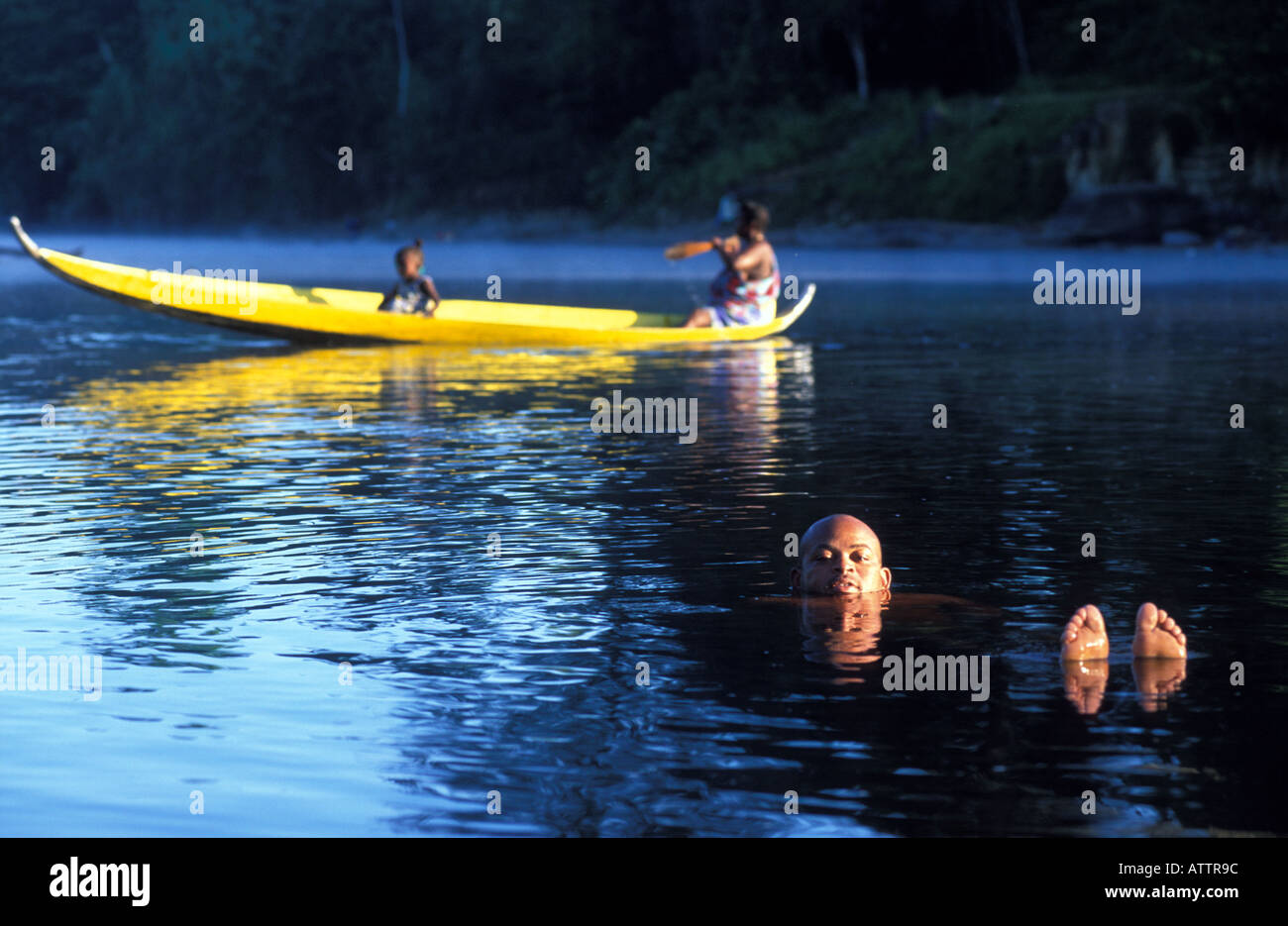 Kumalu Saramaccan swimming in the Pikin Rio river Stock Photo - Alamy