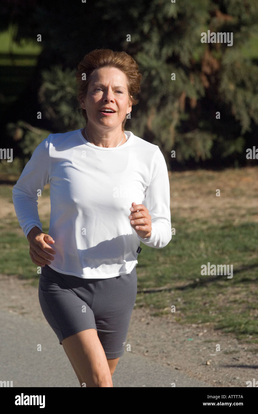Mature female runner Stock Photo - Alamy