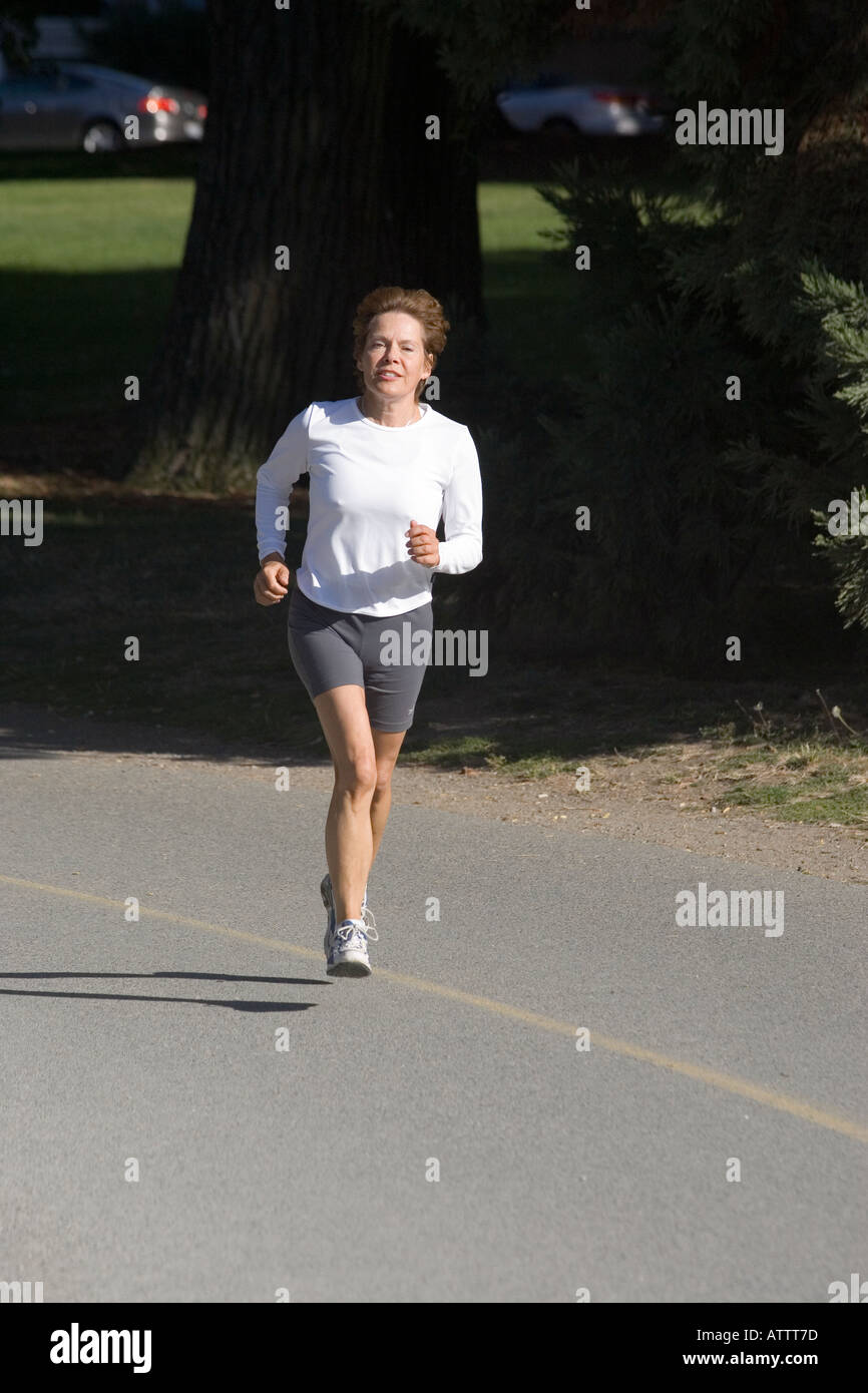 Mature female runner Stock Photo - Alamy