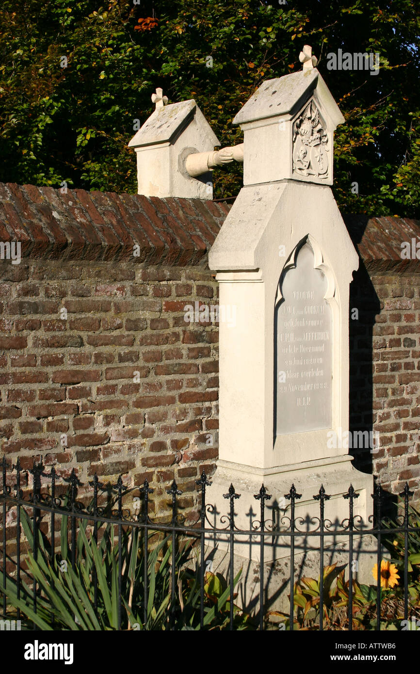 two stone hands reaching out over church yard wall at Het Oude Kerkhof ...