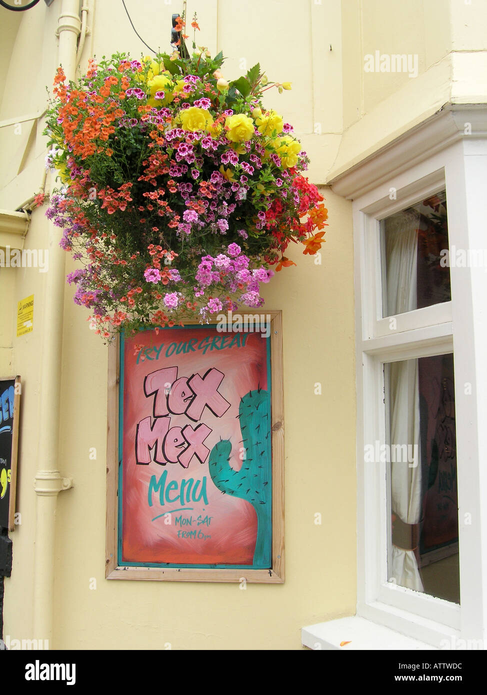 pub sign advertising mexican food Stock Photo - Alamy