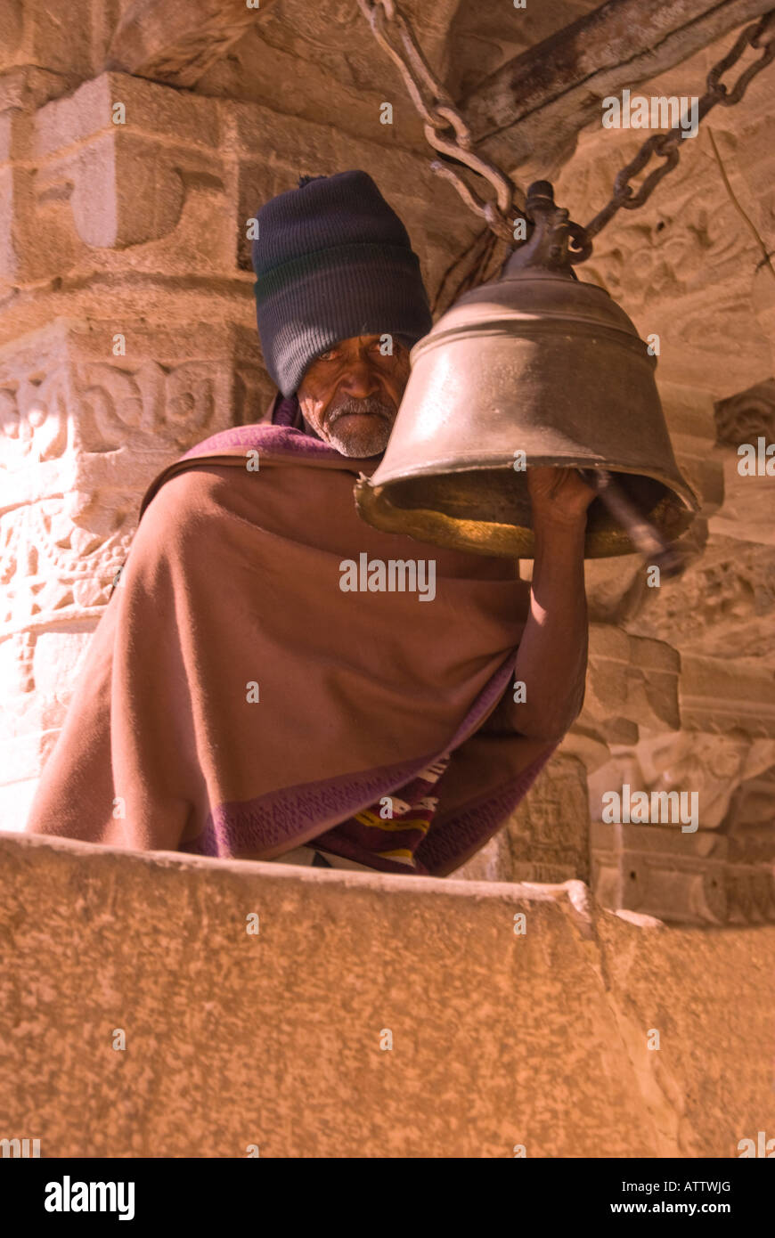 Priest Ringing a Temple Bell in Udaiphur, Rajasthan, India Stock Photo ...