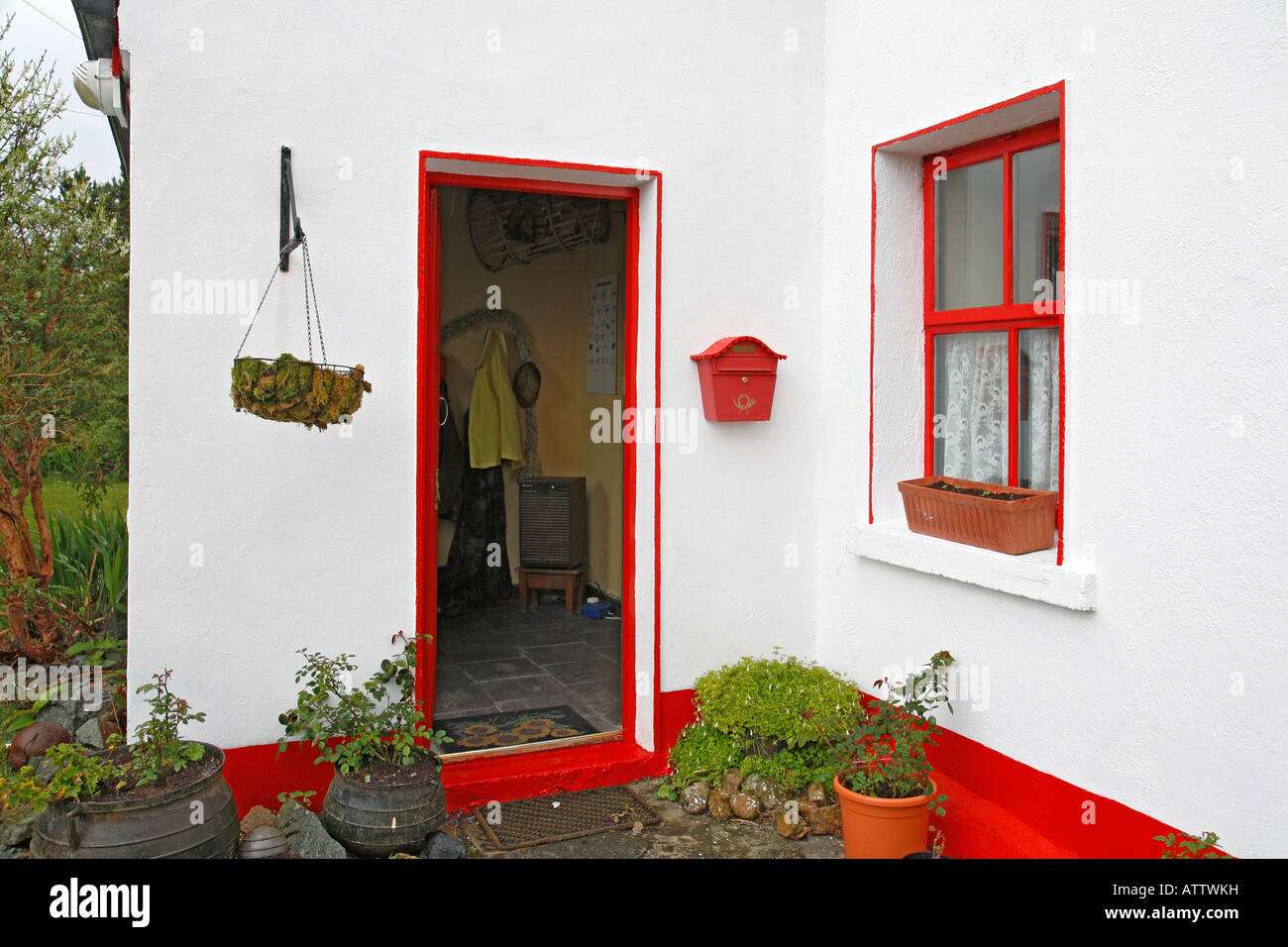 Cottage with red windows and doors in Connema, Ireland Stock Photo - Alamy