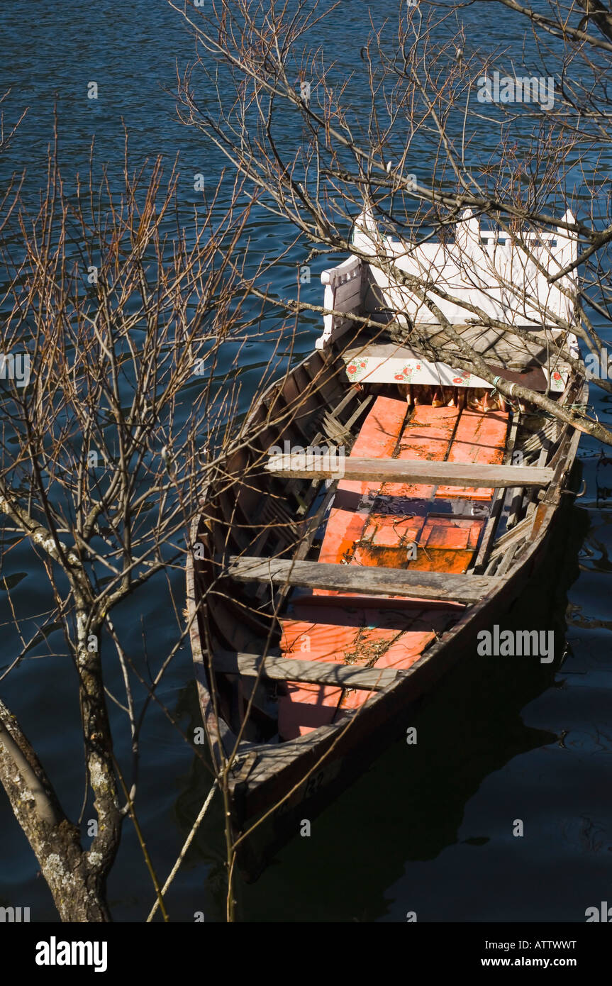 High angle view of a boat tied up with a tree Stock Photo - Alamy