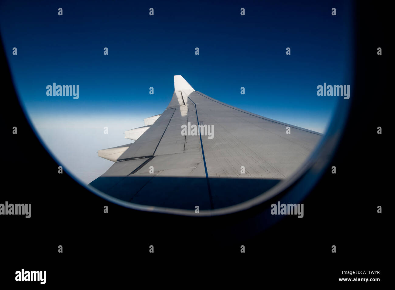 View of aeroplane wing through window Stock Photo - Alamy