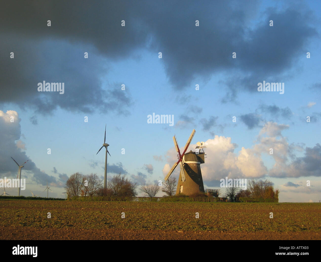 traditional windmill and modern wind turbine germany Stock Photo - Alamy