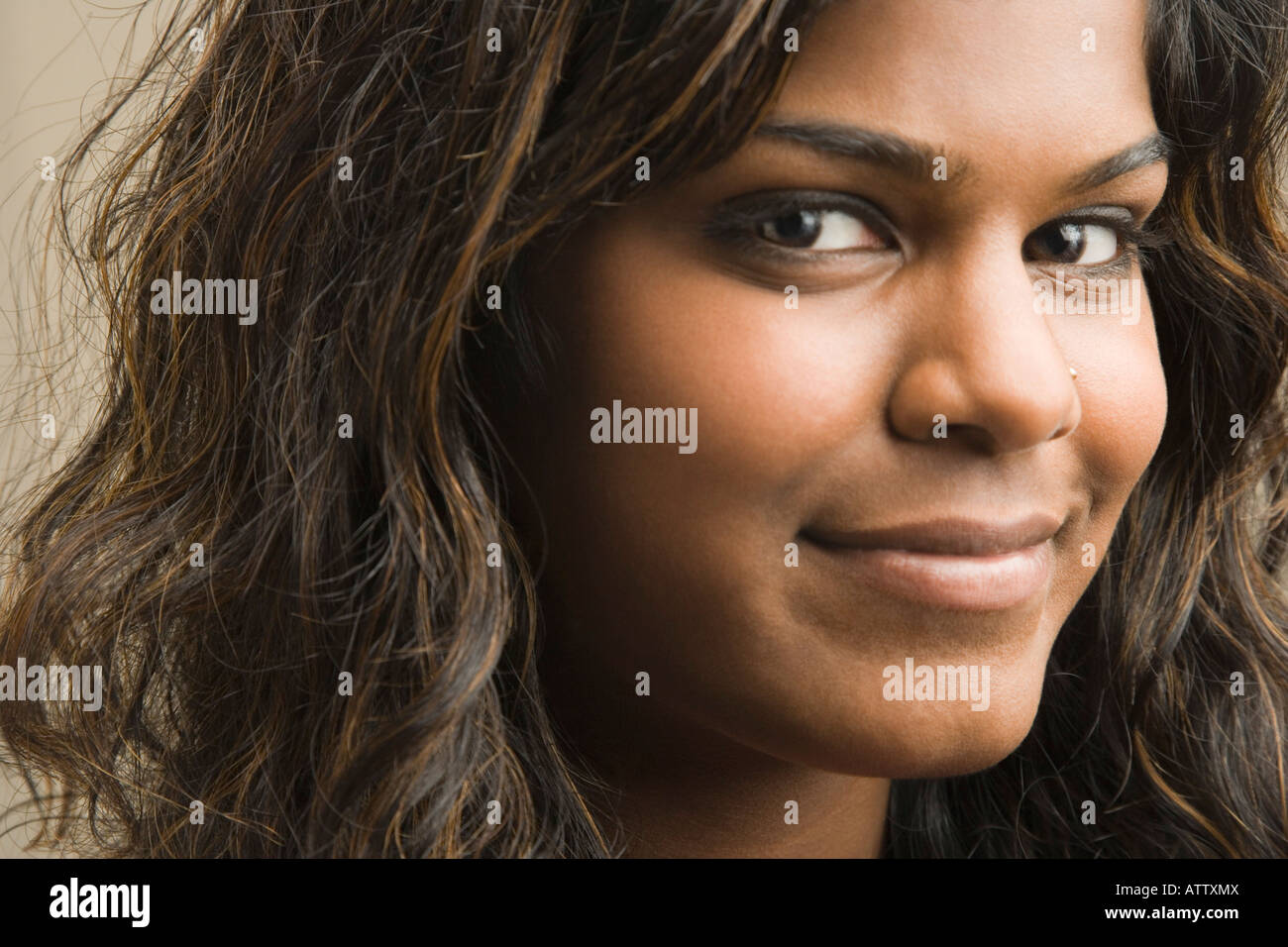 Portrait of a young woman smirking Stock Photo - Alamy