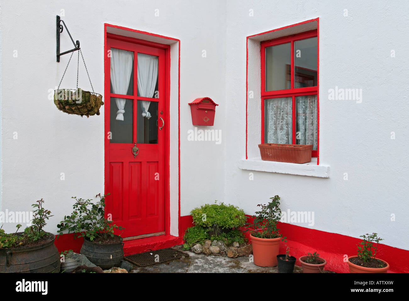 Cottage with red windows and doors in Connema, Ireland Stock Photo - Alamy