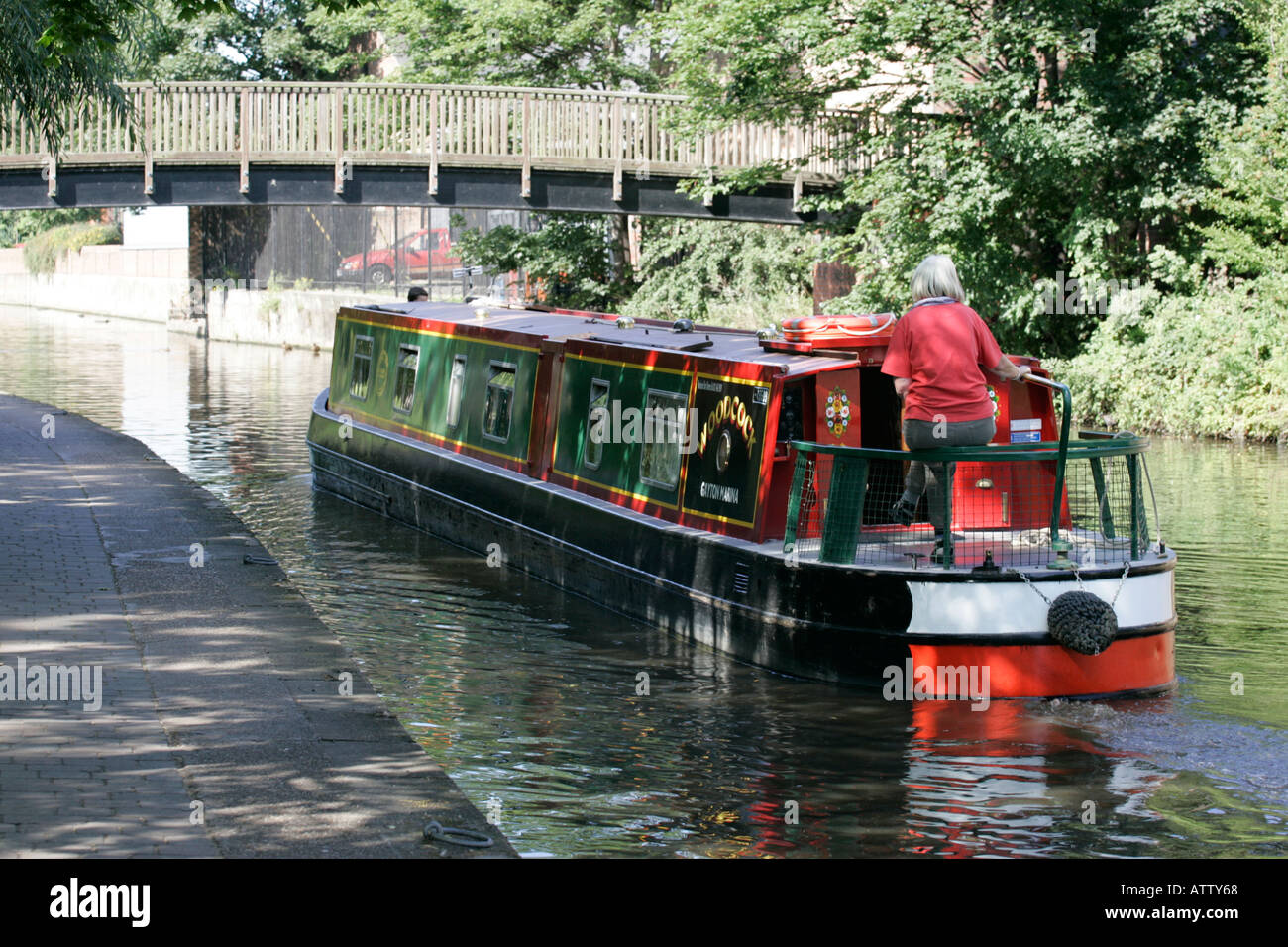 narrowboat on nottingham canal with tow path and footbridge from rear ...