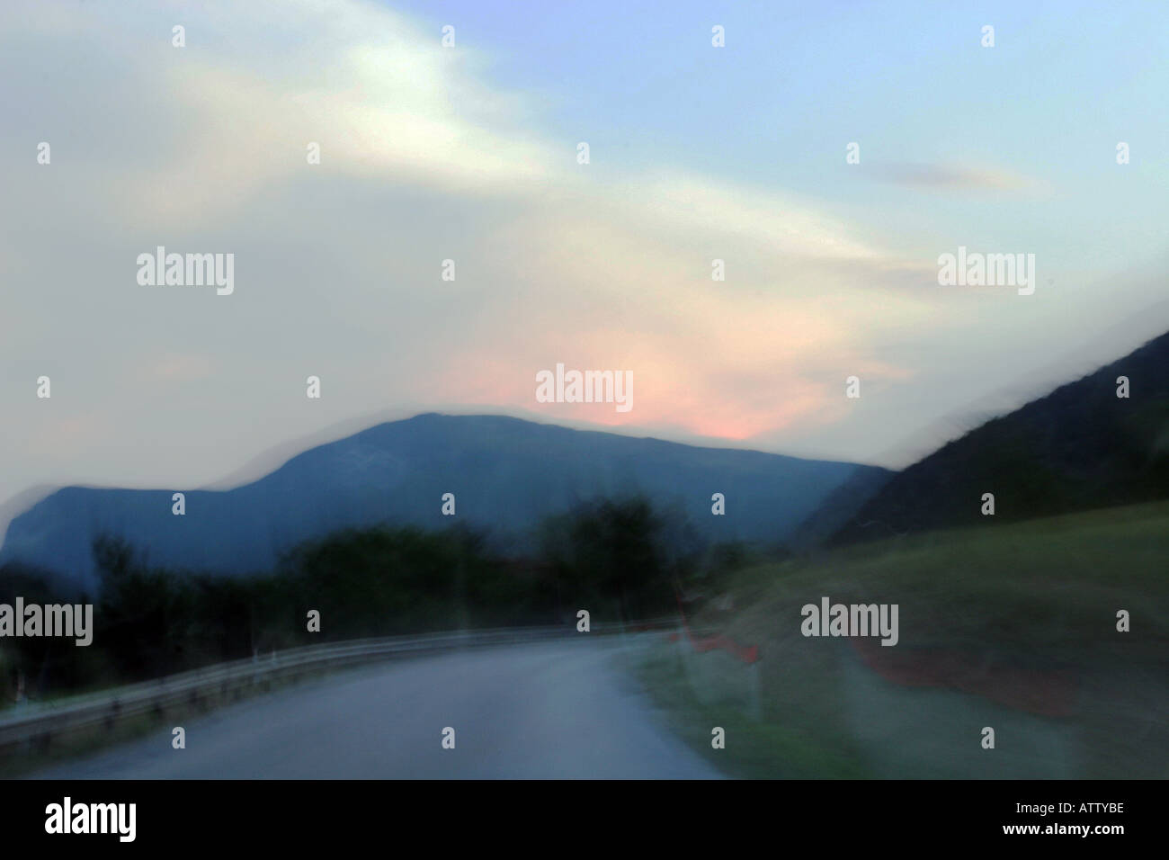 blurred view of road from inside car at dusk Stock Photo - Alamy