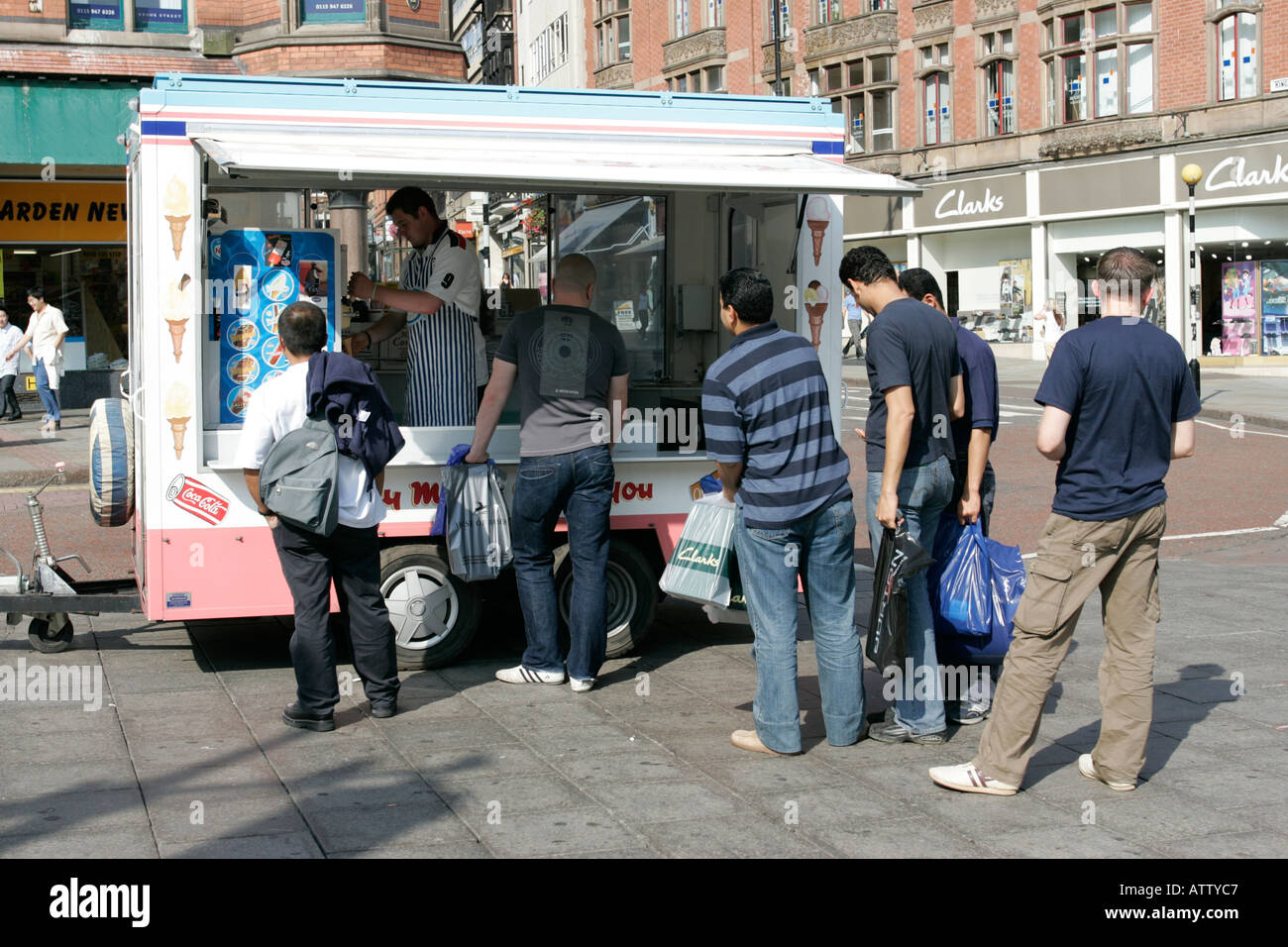 people queuing at mobile ice cream kiosk on a warm summers day old ...