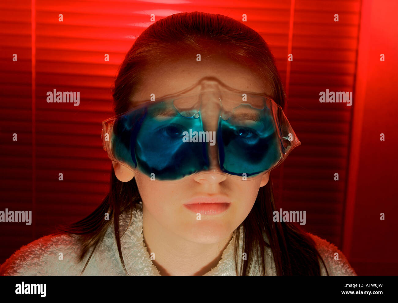 Teen girl with eye pads Stock Photo - Alamy