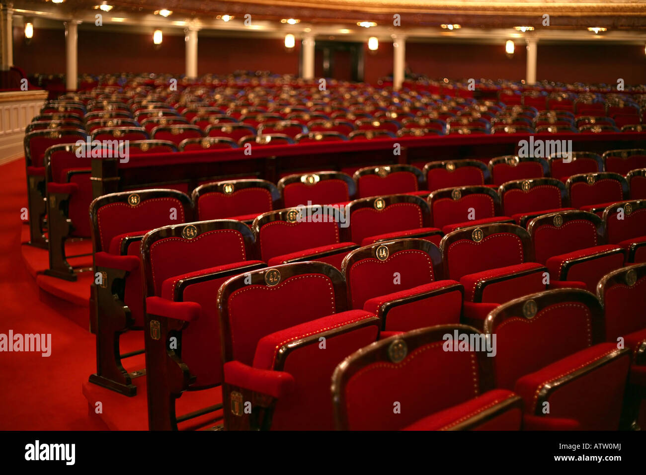 Classical theatre interior with red seat and number Stock Photo - Alamy