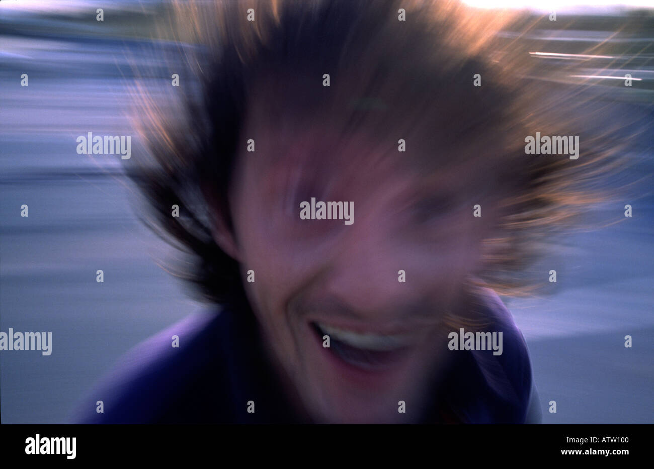 Young man in wacky motion pose Stock Photo - Alamy