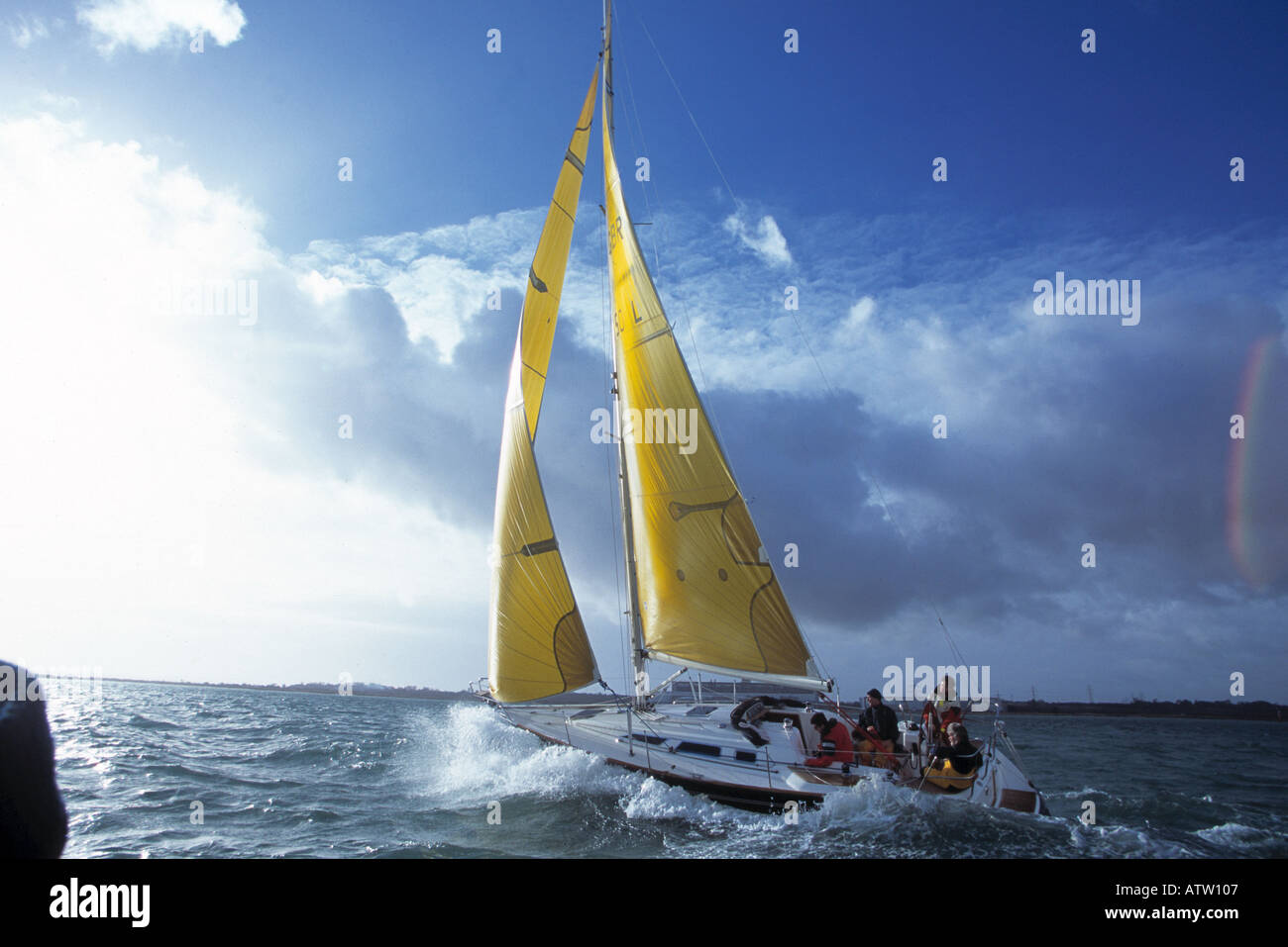 sailing yacht with yellow sails Stock Photo - Alamy