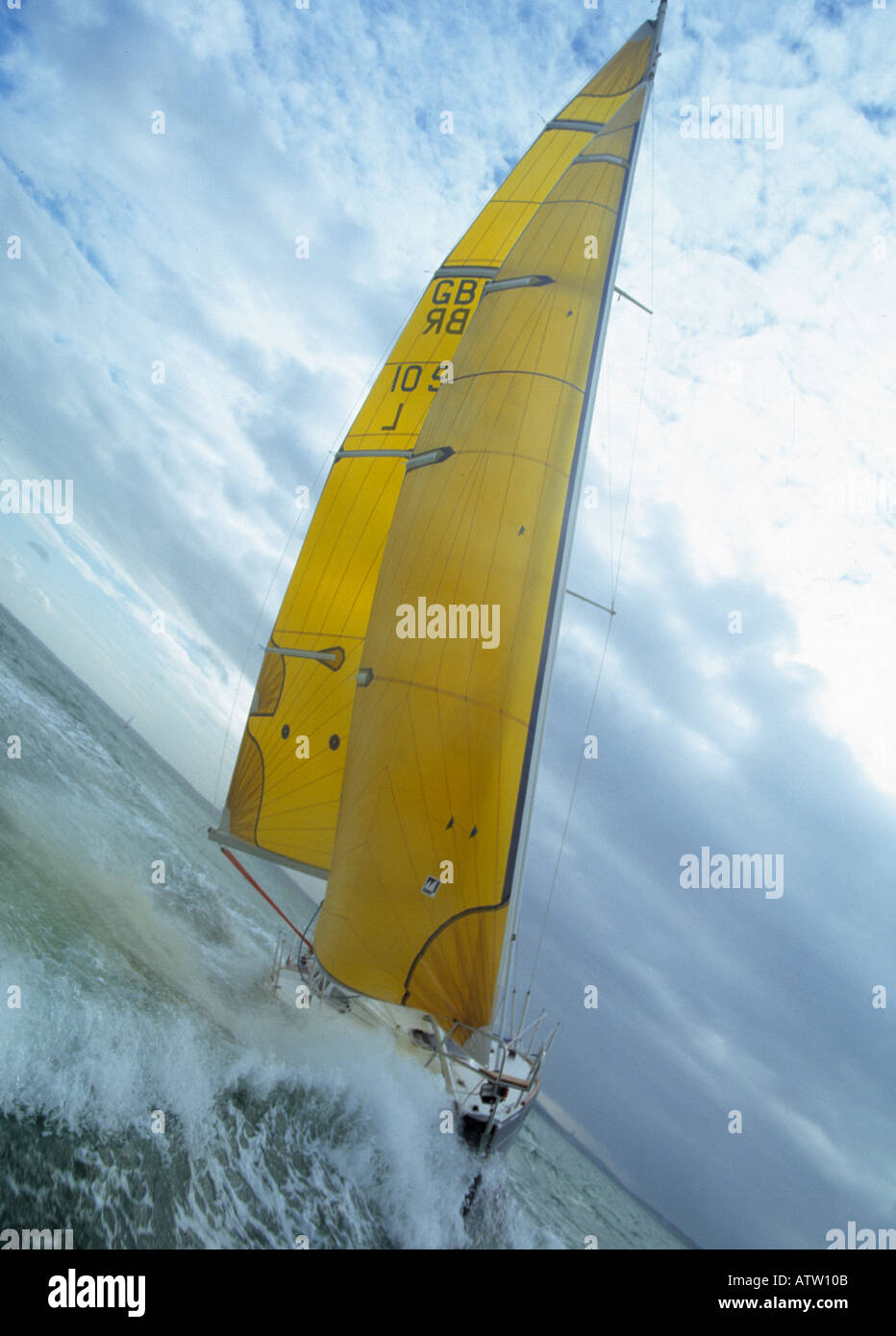 sailing yacht with yellow sails Stock Photo - Alamy