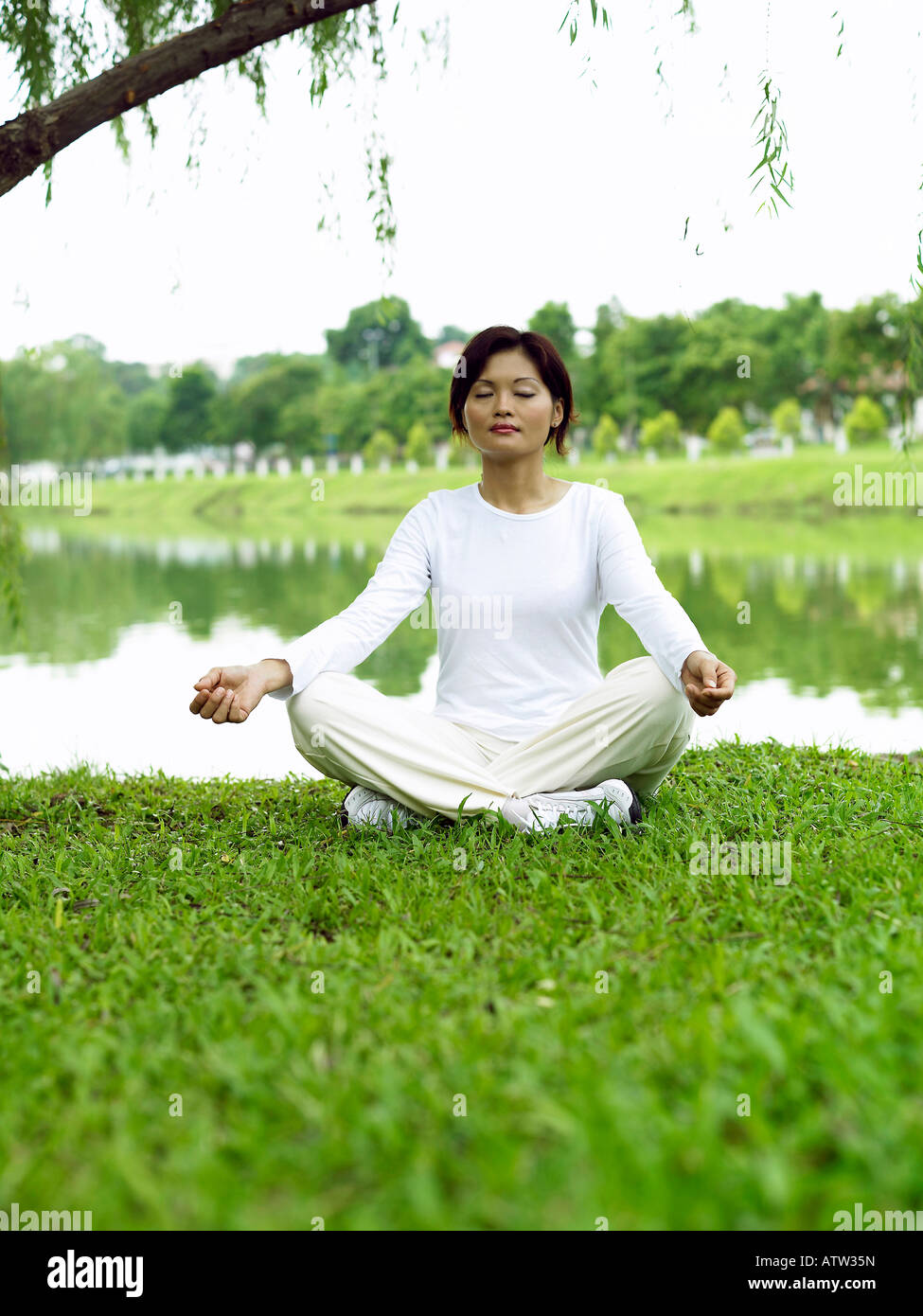 front view of woman doing yoga Stock Photo - Alamy