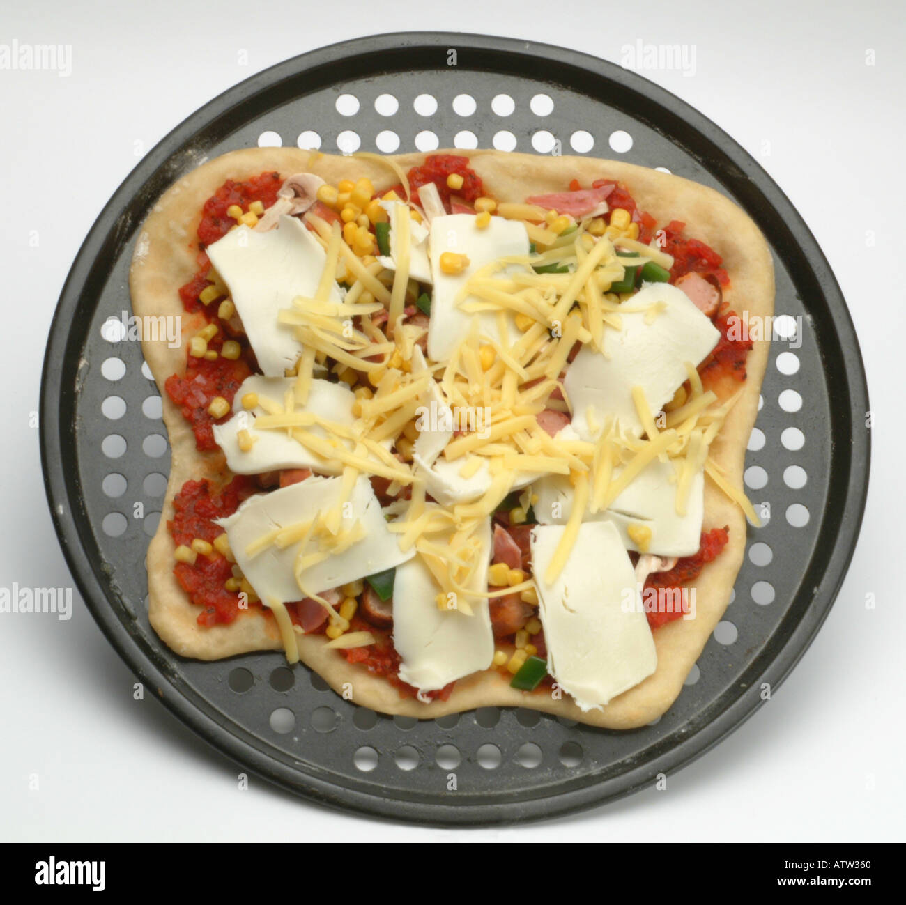 Fresh home made pizza before being cooked square on Stock Photo - Alamy