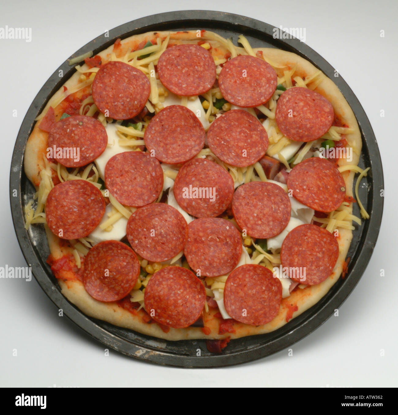 Fresh home made pizza before being cooked square on Stock Photo - Alamy