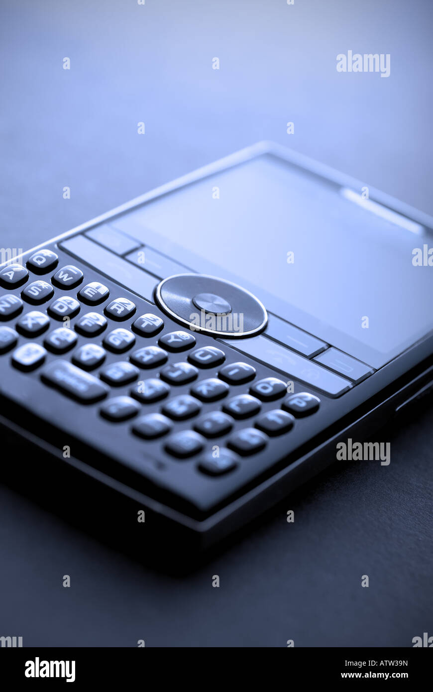 Shallow focus Macro of a Smart phone with full keyboard High tech blue ...