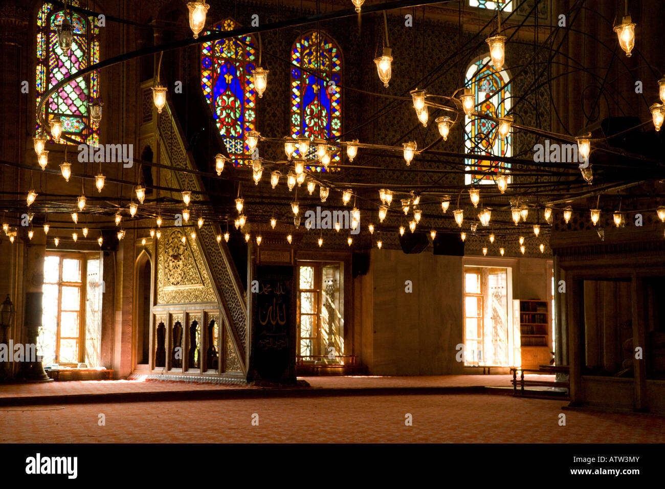 Interior of Blue Mosque showing the Minbar and stained glass windows ...