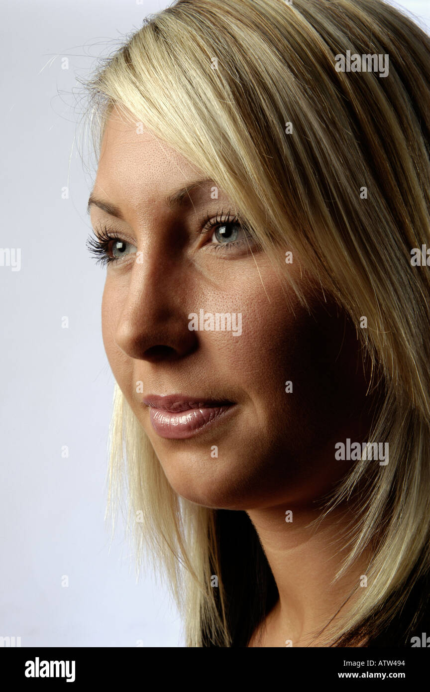 Portrait of young blonde English woman face in profile looking left ...