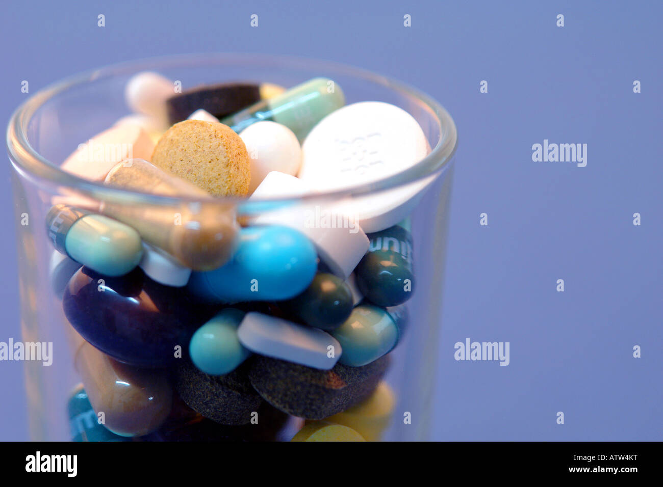 cocktail of pills, glass full of pills Stock Photo - Alamy