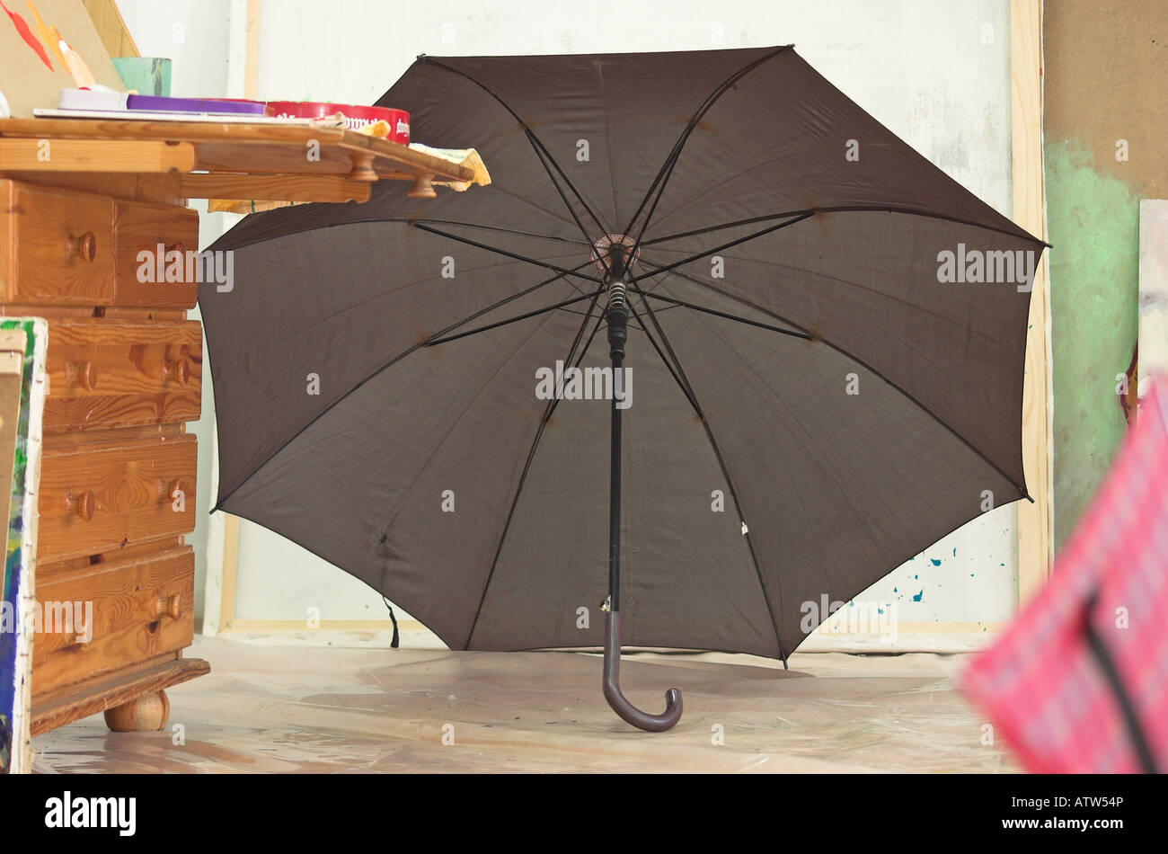 Umbrella in university classroom Stock Photo - Alamy