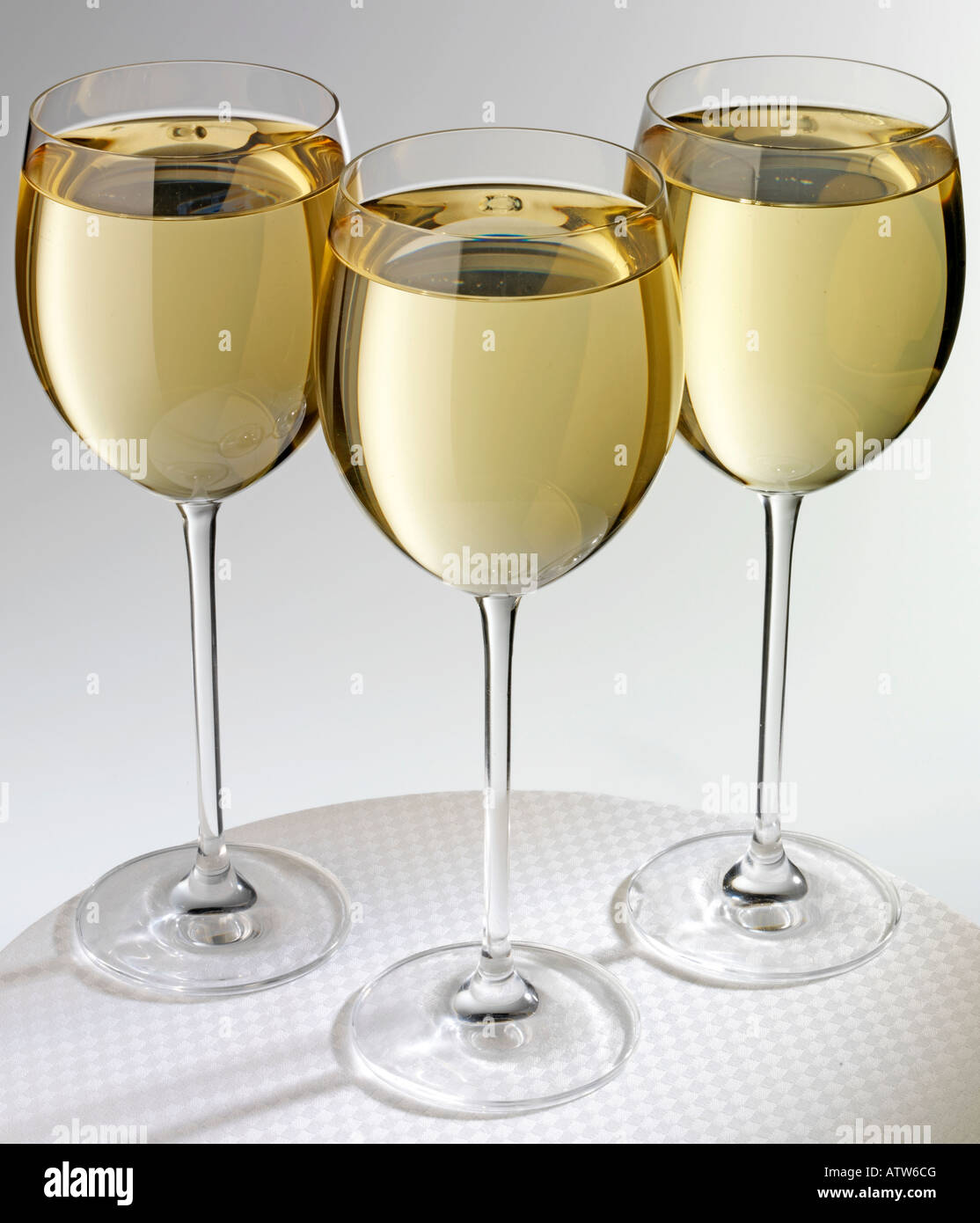 THREE GLASSES OF WHITE WINE Stock Photo - Alamy