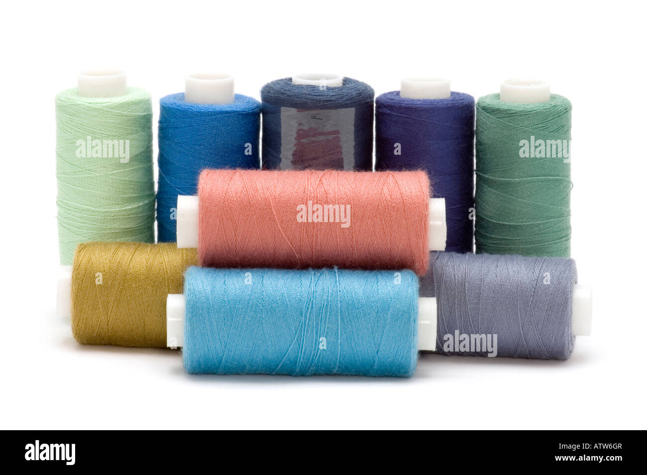 object on white spool of thread Stock Photo - Alamy