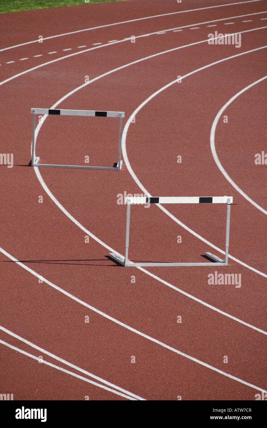 hurdles on athletic track Stock Photo - Alamy