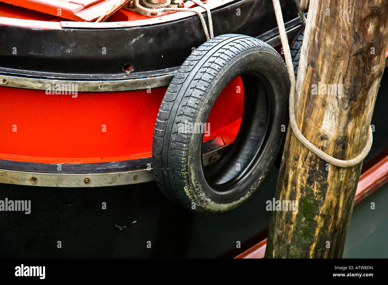 Colourful barge moored to a post Stock Photo - Alamy
