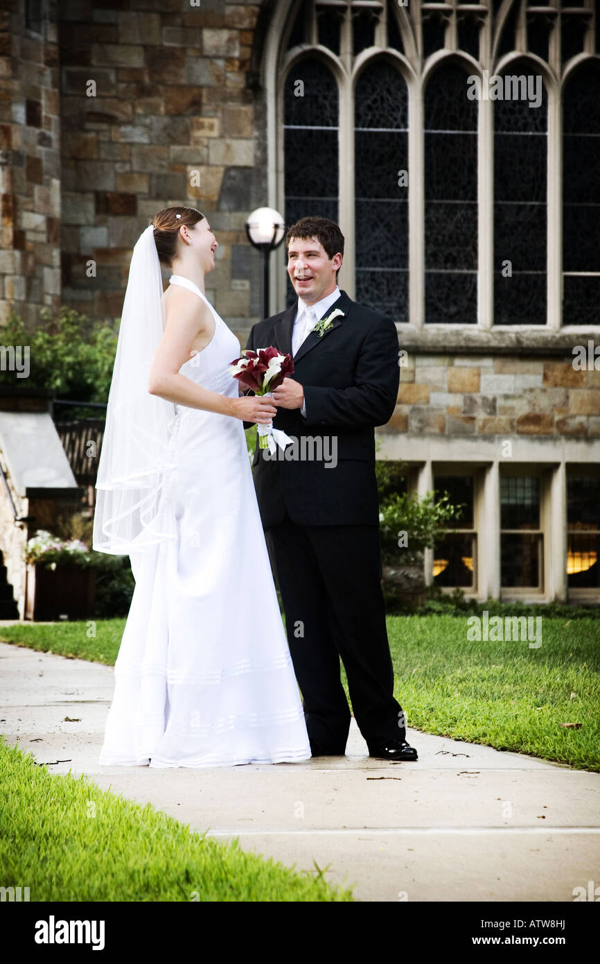 bride and groom wedding couple talking and laughing Stock Photo - Alamy