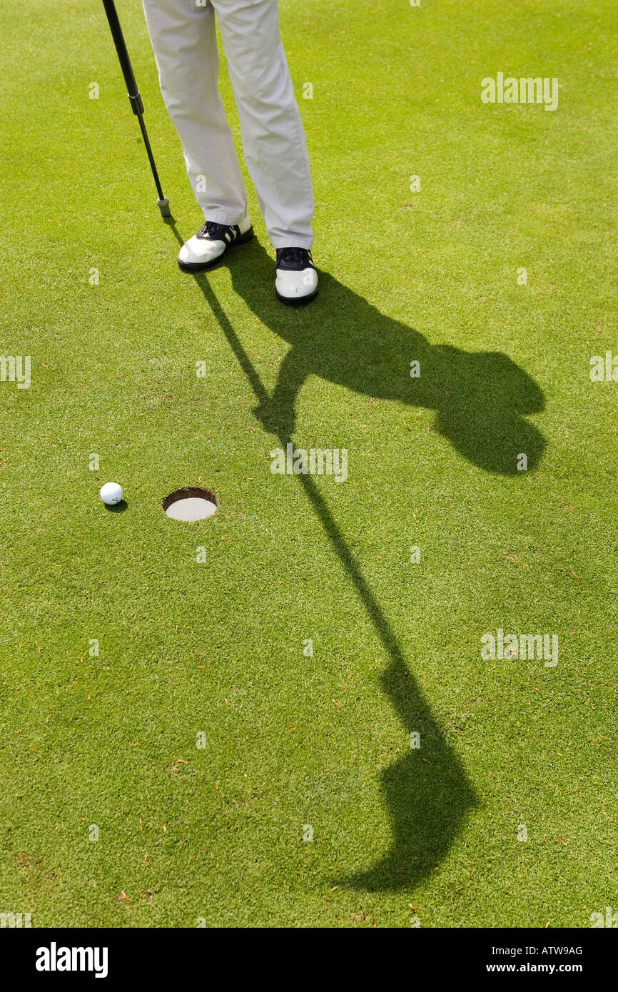 golf green hole flag shadow Stock Photo - Alamy