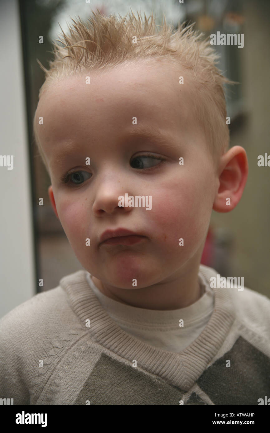 a little boy sulking Stock Photo - Alamy