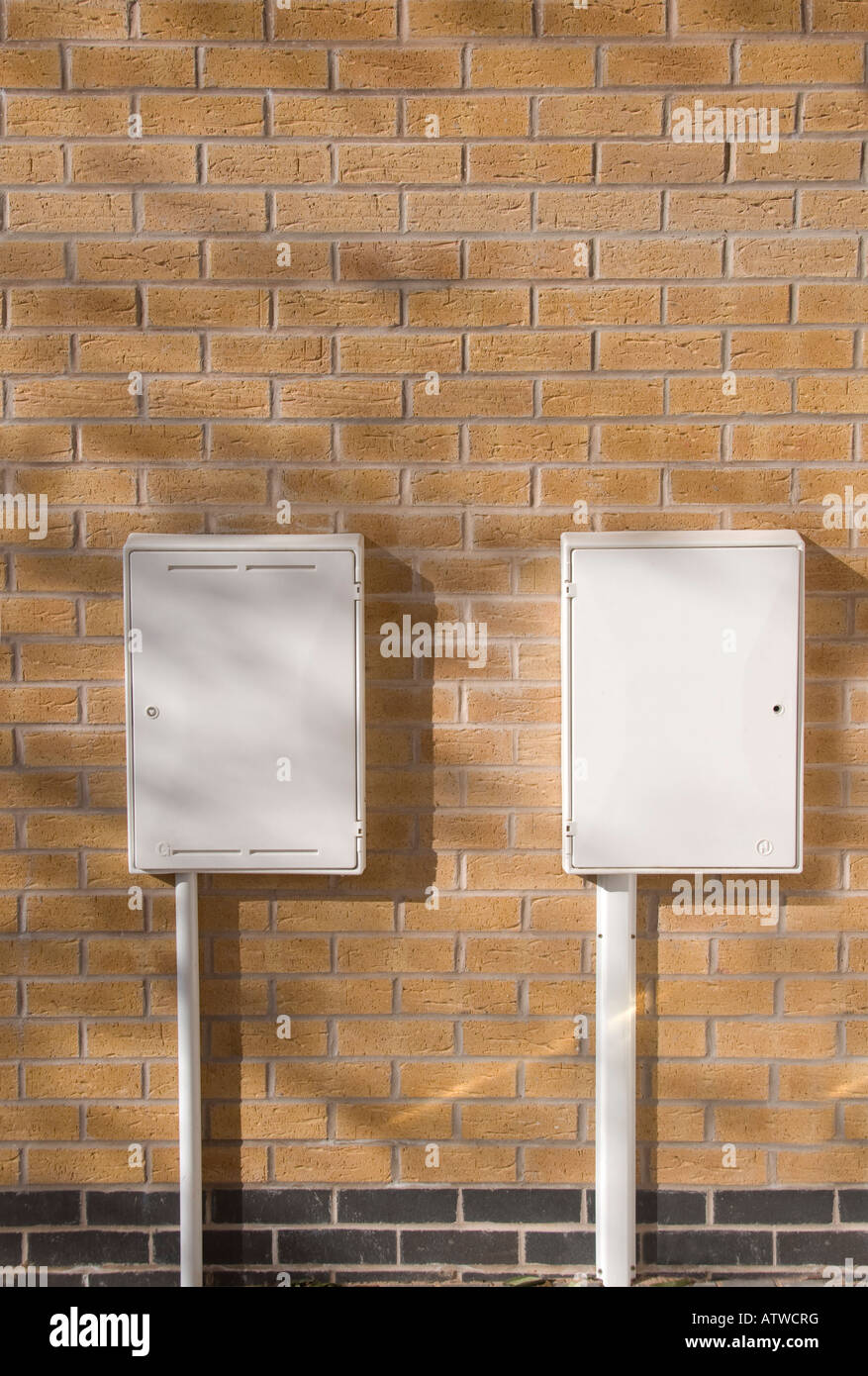 Gas and electricity boxes on wall Stock Photo - Alamy