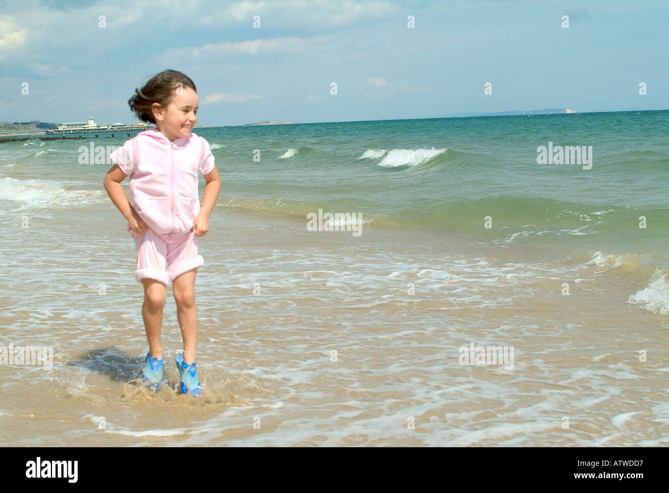 Child jumping over waves hi-res stock photography and images - Alamy