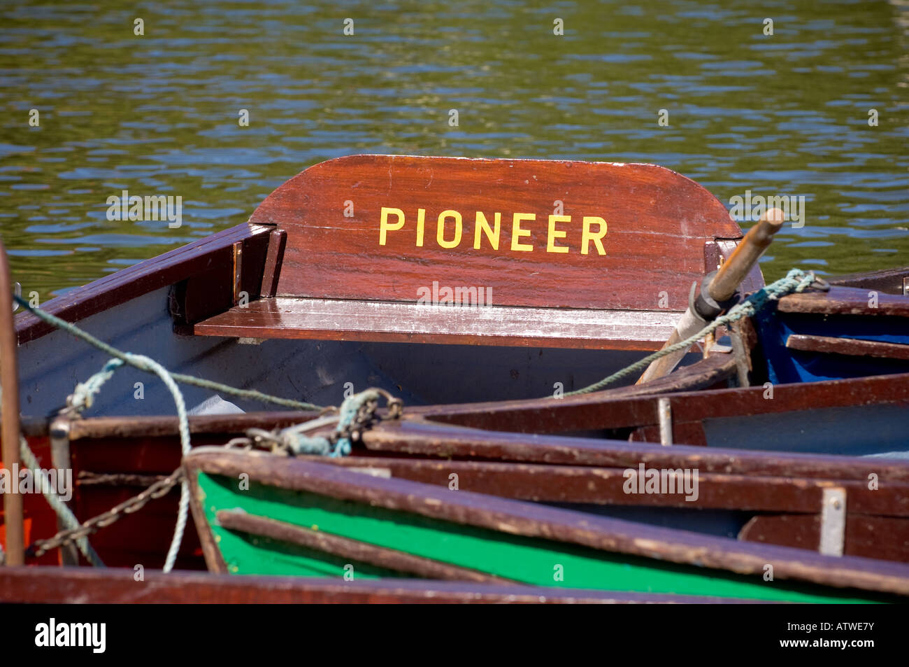 Wooden nameplate on the stern of a rowing boat called Pioneer Stock ...