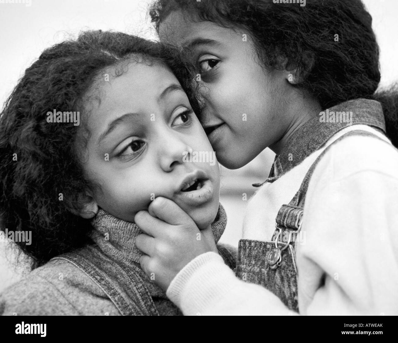 Whispering Black and White Stock Photos & Images - Alamy