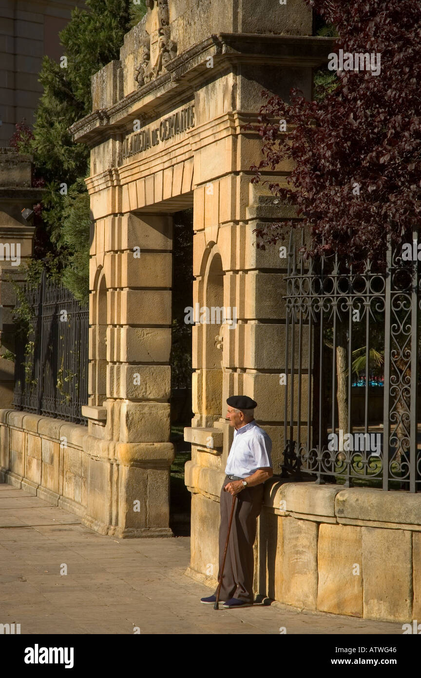 An elderly spanish gentleman stands outside the park entrance in the ...