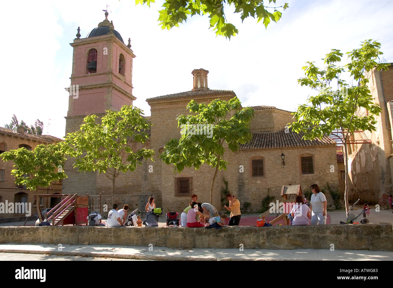 Spanish women and their children congregate at a small square at Puenta ...